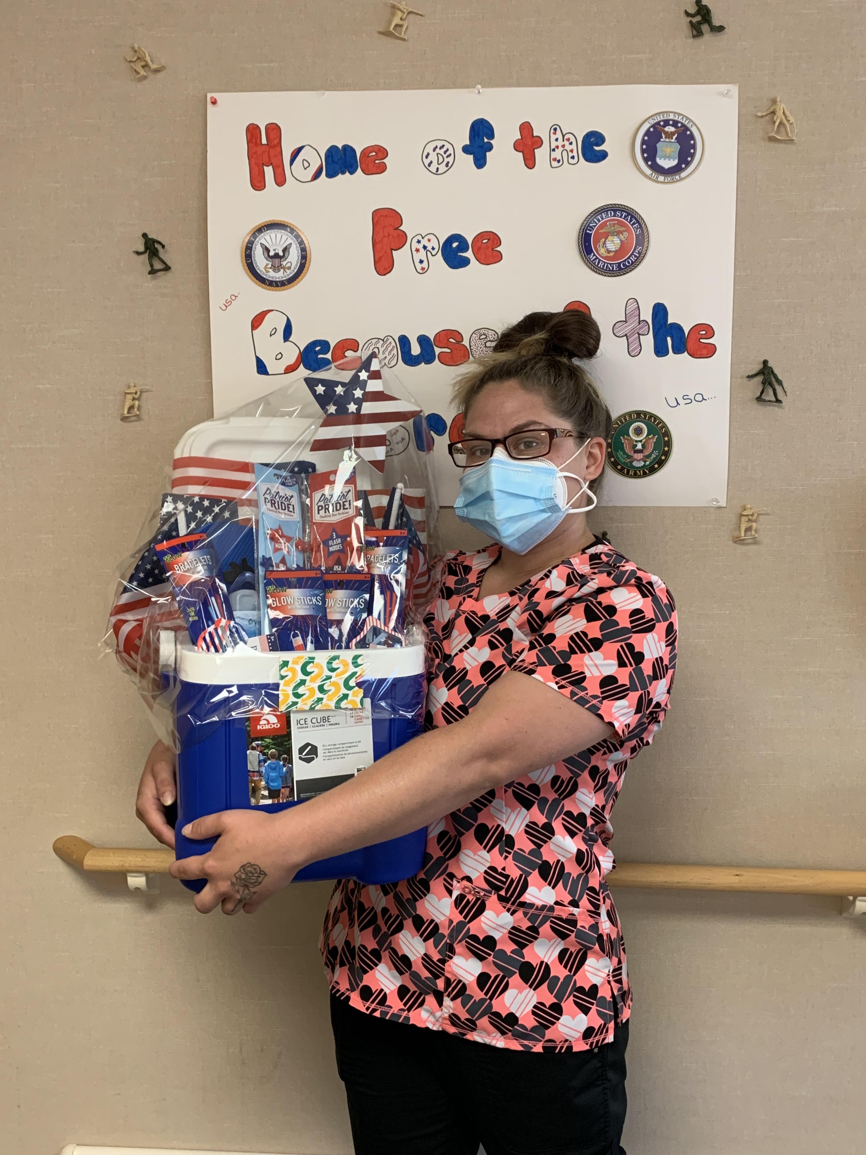 Riverview Pointe Awards Employee with Patriotic Basket